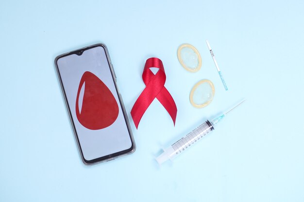 Cinta roja y símbolo de dispositivo médico contra el virus del vih ... Cinta roja y símbolo de dispositivo médico contra el virus del vih ...