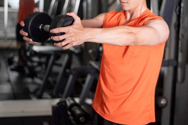 Premium Photo | Asian man is working out in fitness gym Premium Photo | Asian man is working out in fitness gym