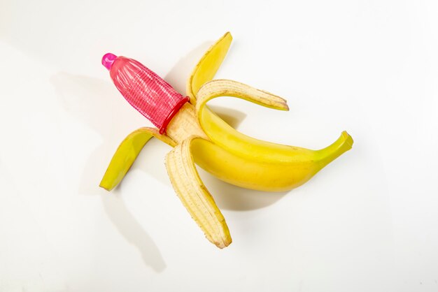 Premium Photo Banana With Red Condom