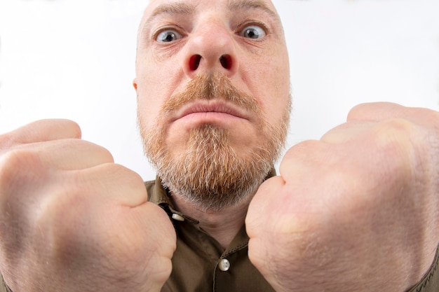 Premium Photo Bearded Man With Clenched Fists Closeup On White