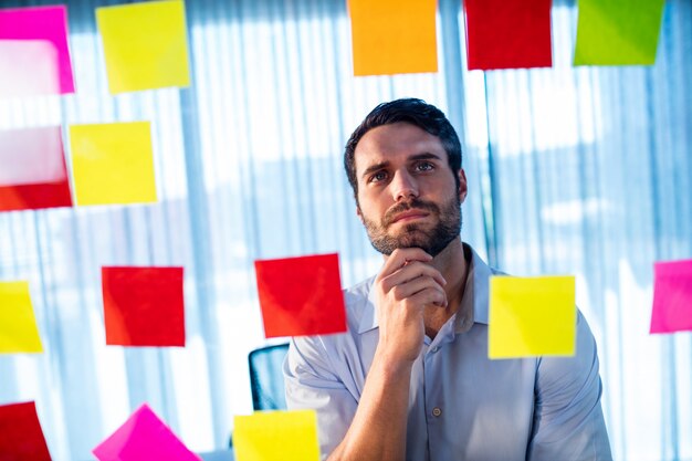 Premium Photo | Businessman reading post it Premium Photo | Businessman reading post it