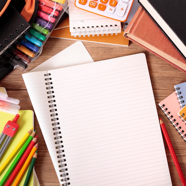Premium Photo | Busy student's desk with blank folded notebook Premium Photo | Busy student's desk with blank folded notebook