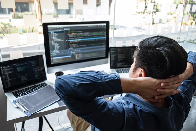 Premium Photo | Professional team of programmer working on project in ...