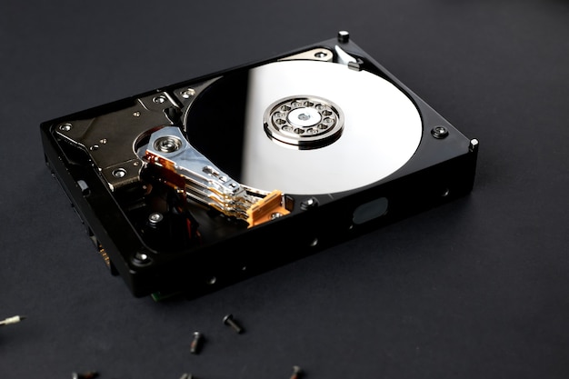 Premium Photo | Disassembled hard drive disk from the computer Premium Photo | Disassembled hard drive disk from the computer