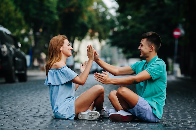 Free Photo Guy And Girl Playing Clapping Game Outside