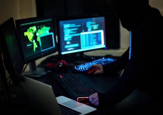Premium Photo | Hacker working using computer with codes Premium Photo | Hacker working using computer with codes