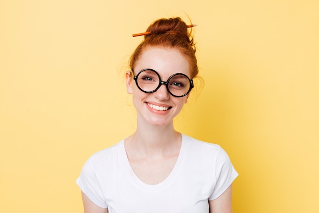 Free Photo | Image of smiling ginger woman in eyeglasses looking Free Photo | Image of smiling ginger woman in eyeglasses looking