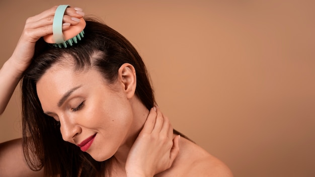 Free Photo Medium Shot Woman Giving Herself Scalp Massage
