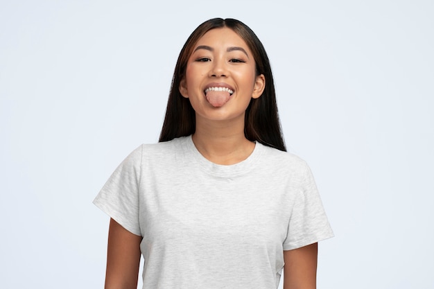Free Photo Medium Shot Woman Sticking Out The Tongue