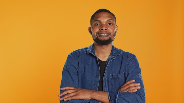 Free Photo | Portrait of confident person smiling on camera against ... Free Photo | Portrait of confident person smiling on camera against ...
