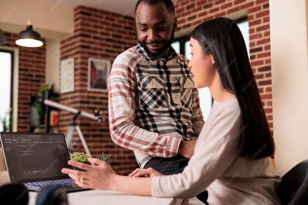 Free Photo | Programmers couple developing encryption code on laptop, using terminal window with ...