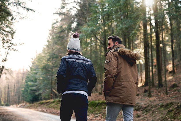 Free Photo Rear View Of Father And Son Walking In Autumn Forest