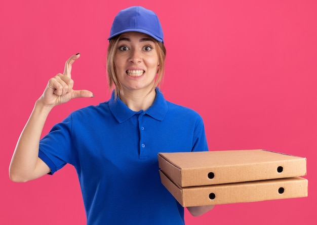 Free Photo Surprised Young Pretty Delivery Girl In Uniform With Pizza