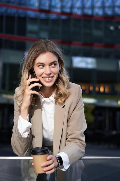 Free Photo | Vertical shot of smiling businesswoman answer mobile phone ... Free Photo | Vertical shot of smiling businesswoman answer mobile phone ...