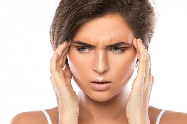 Premium Photo | Woman with a headache Premium Photo | Woman with a headache