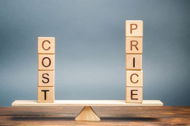 Premium Photo | Wooden blocks with the word cost and price on the ... Premium Photo | Wooden blocks with the word cost and price on the ...