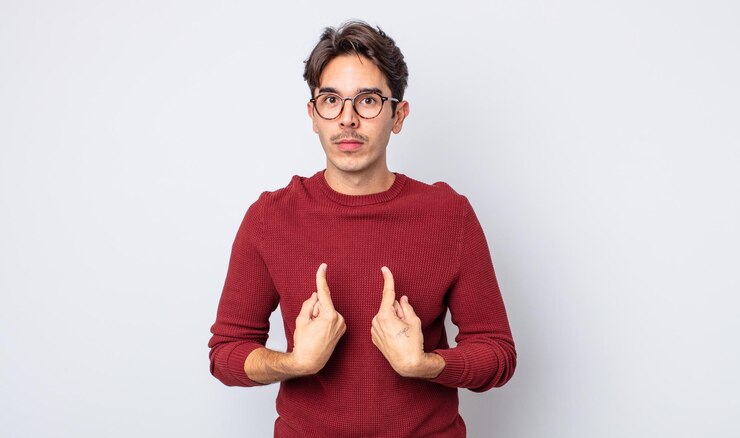 Premium Photo | Young handsome hispanic man pointing to self with a ... Premium Photo | Young handsome hispanic man pointing to self with a ...