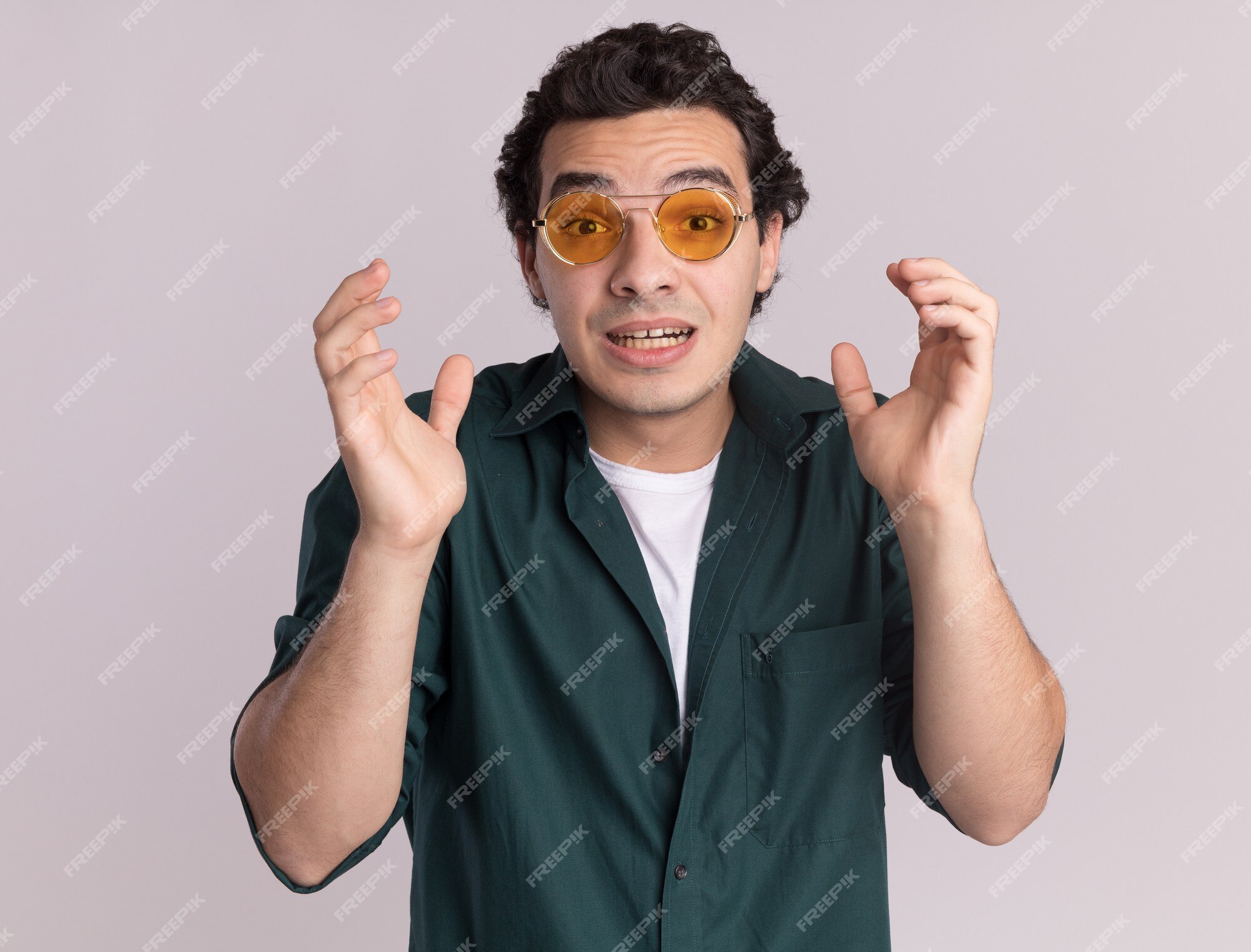 Free Photo Young Man In Green Shirt Wearing Glasses Looking At Front