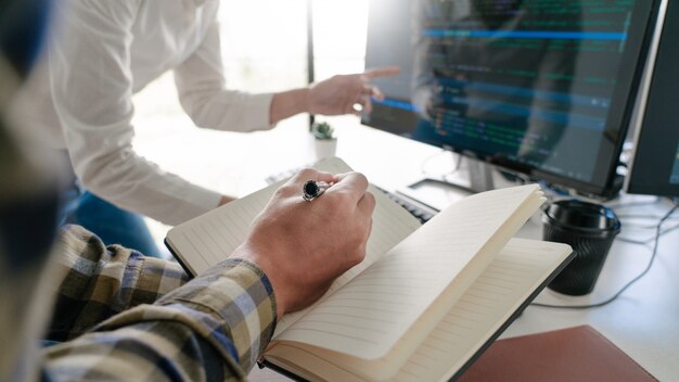 Premium Photo | Programmers developing codes on their computers