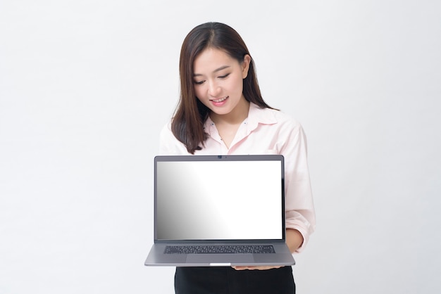 Premium PSD | Asian woman holding laptop computer mockup Premium PSD | Asian woman holding laptop computer mockup