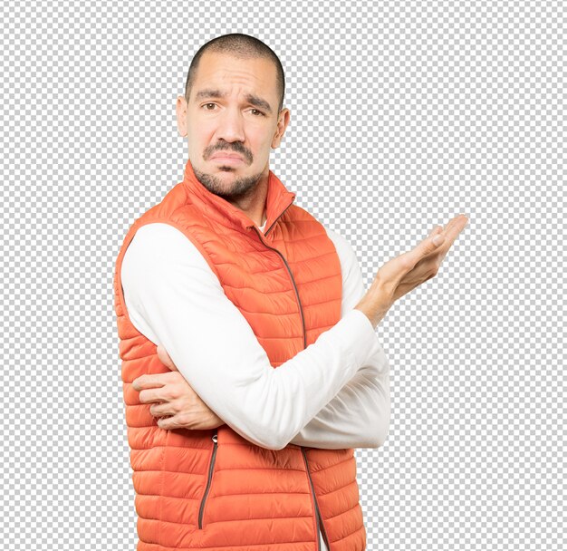 Premium PSD | Puzzled young man doing a gesture of not understand Premium PSD | Puzzled young man doing a gesture of not understand