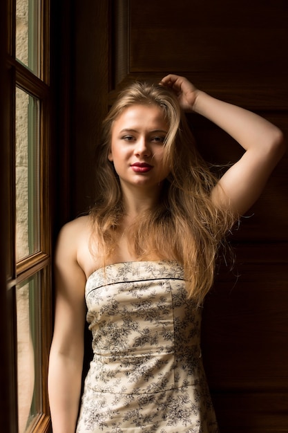 Premium Photo Adorable Blonde Woman With Long Hair Wearing Dress With