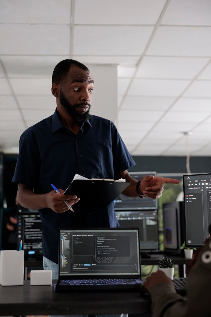 Premium Photo | African american web developer analyzing html script on terminal window, using ...