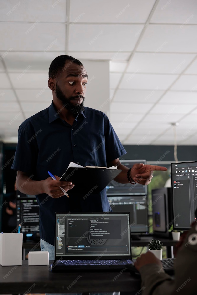Premium Photo | African american web developer analyzing html script on terminal window, using ...