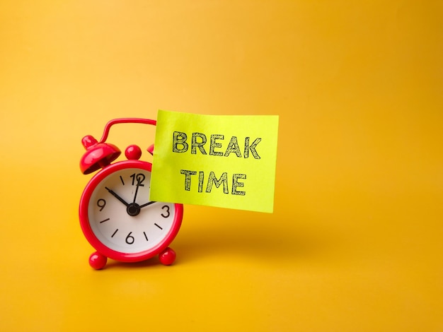 Premium Photo | Alarm clock and sticky note with the word BREAK TIME Premium Photo | Alarm clock and sticky note with the word BREAK TIME