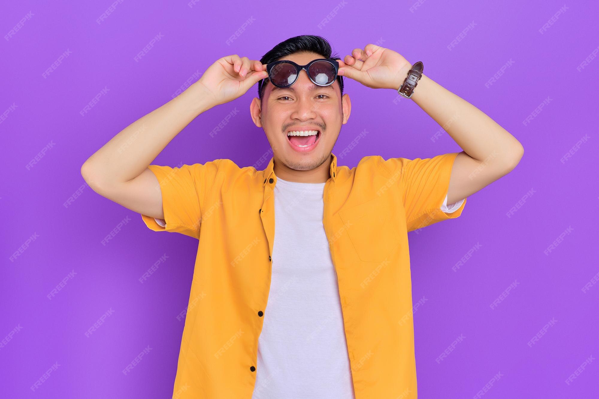 Premium Photo Amazed Handsome Young Asian Man Taking Off Glasses With