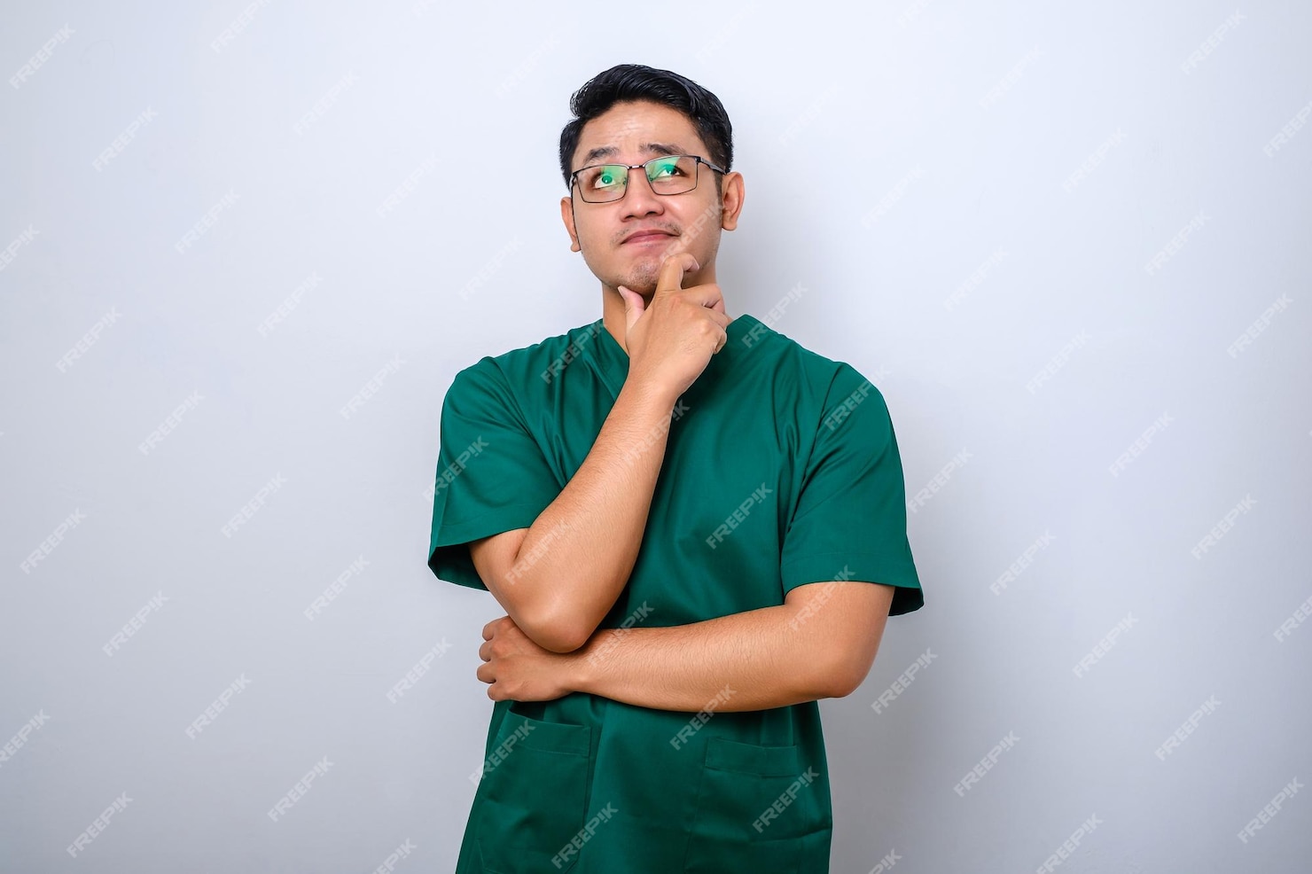 Premium Photo | Asian male doctor in scrubs looking thinking searching ... Premium Photo | Asian male doctor in scrubs looking thinking searching ...