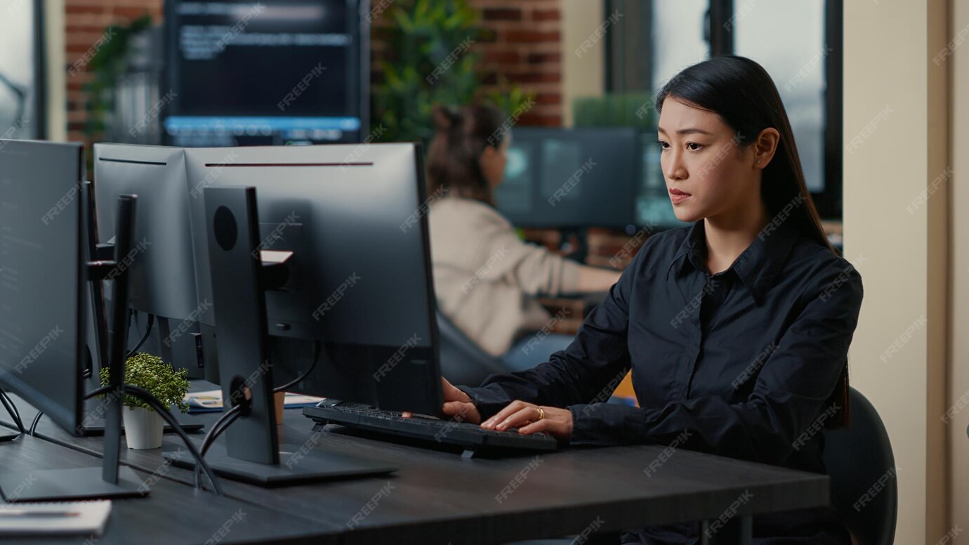 Premium Photo Asian Software Developer Focused On Writing Code 1109