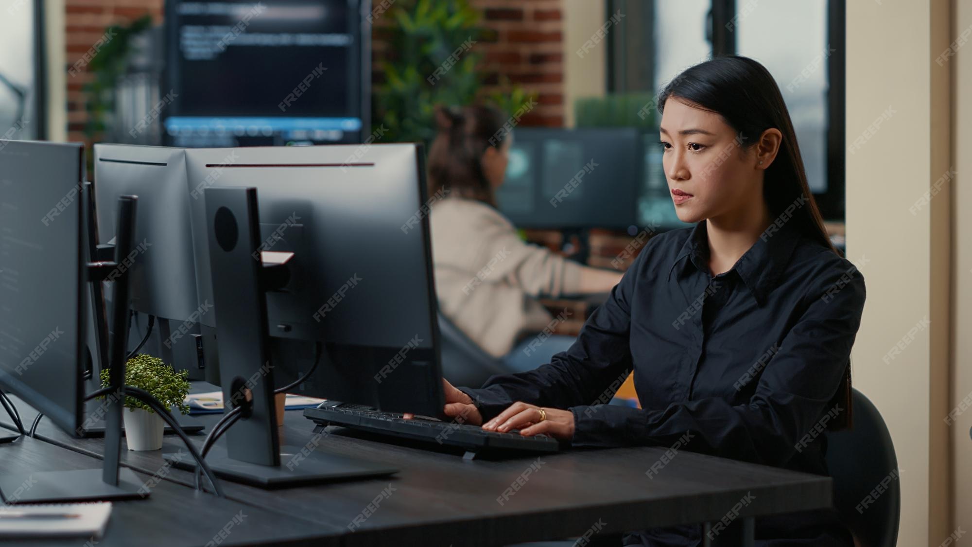 Premium Photo Asian Software Developer Focused On Writing Code Encounters Unexpected Compiling