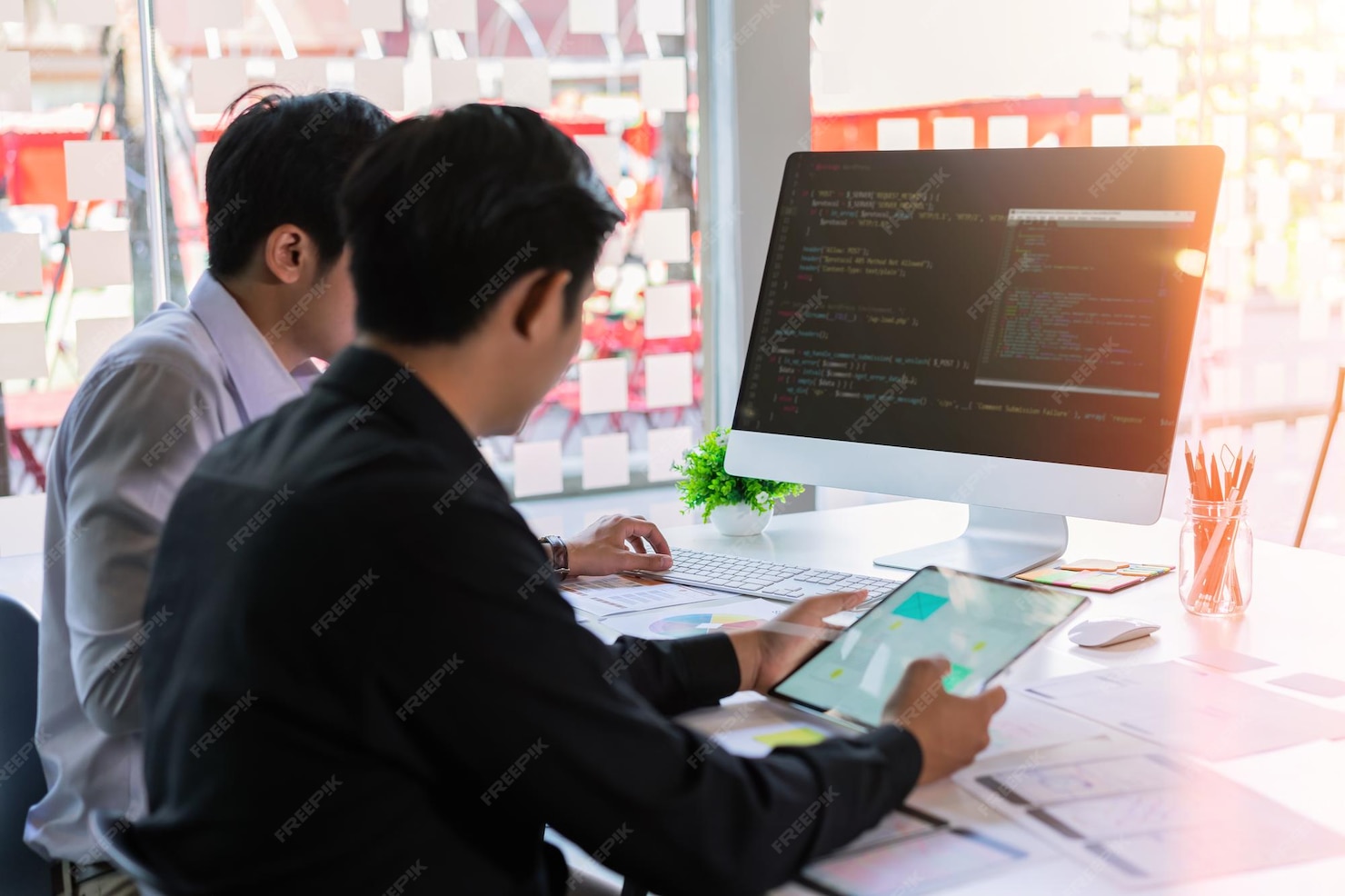 Premium Photo | Attractive two young programmers team developing ...