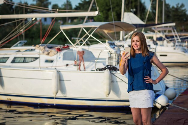 Premium Photo Attractive Woman Taking Selfie Photo On Smartphone