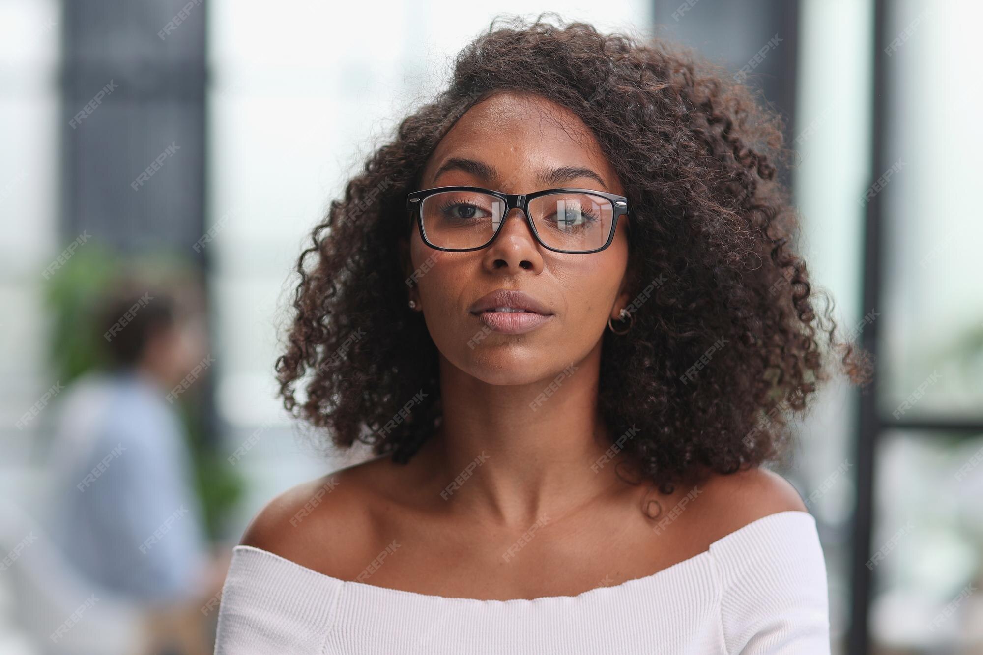 Premium Photo | Beautiful female african american business woman in office Premium Photo | Beautiful female african american business woman in office