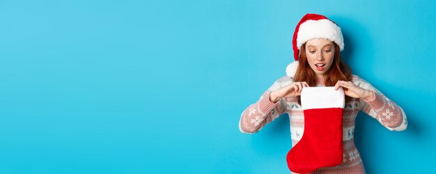 Premium Photo Beautiful Redhead Girl In Santa Hat Open Christmas