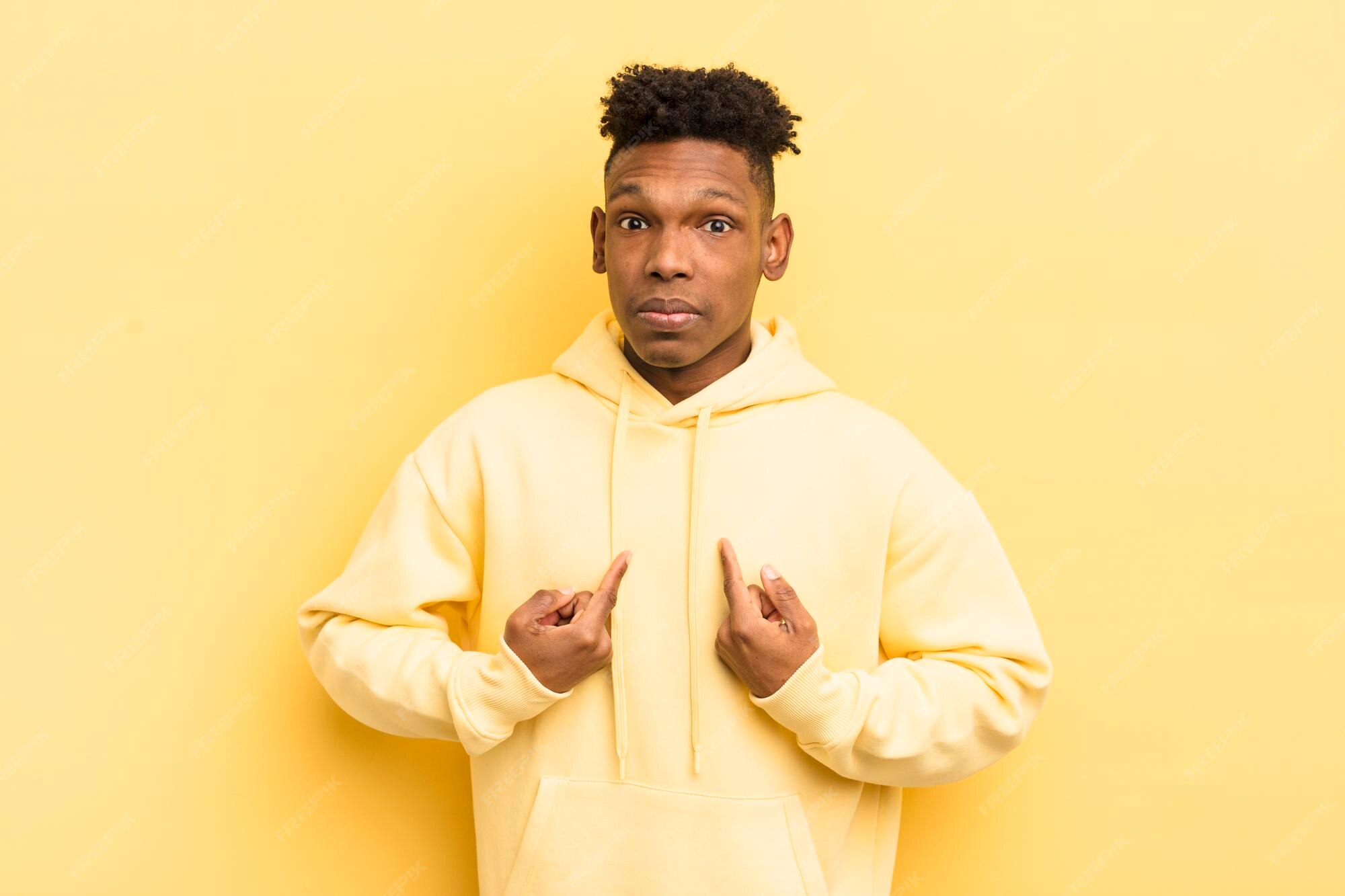 Premium Photo | Black afro young man pointing to self with a confused ... Premium Photo | Black afro young man pointing to self with a confused ...
