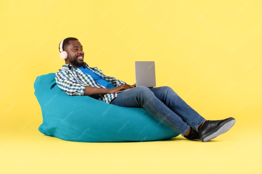 Premium Photo | Black Man Using Laptop Wearing Headphones Sitting Over ... Premium Photo | Black Man Using Laptop Wearing Headphones Sitting Over ...