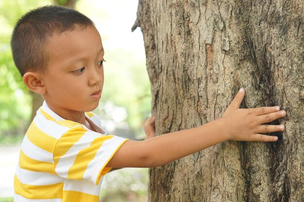 Premium Photo Boy Playing Hide And Seek In The Garden 3321