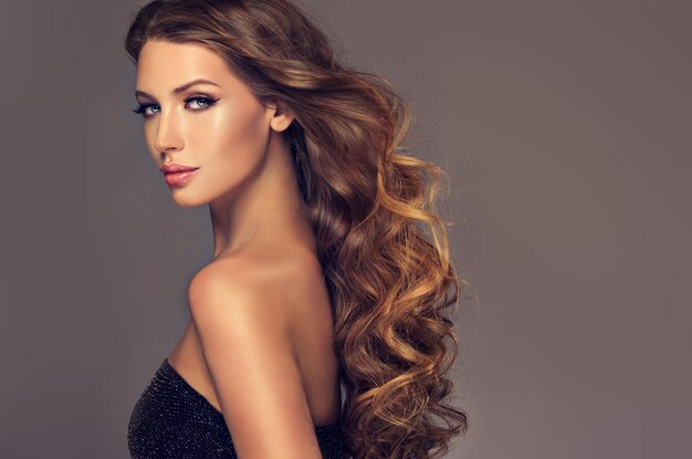 Premium Photo Brunette Girl With Long And Volume Shiny Wavy Hair