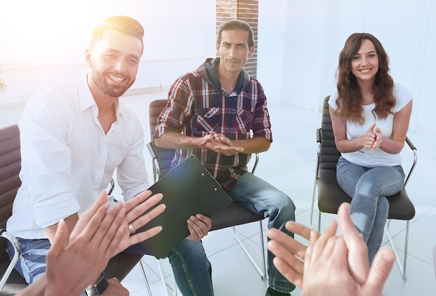 Premium Photo | Business team applauding their manager Premium Photo | Business team applauding their manager