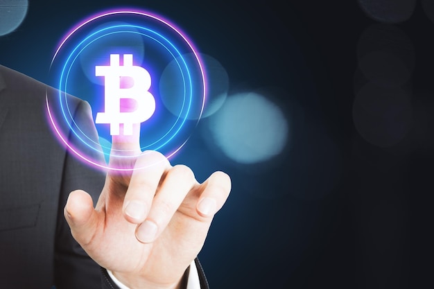 Premium Photo | Businessman hand presses bitcoin button Premium Photo | Businessman hand presses bitcoin button