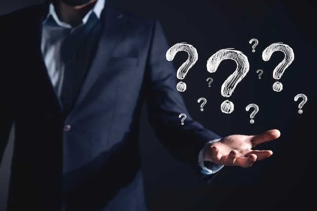 Premium Photo | Businessman hand question mark Premium Photo | Businessman hand question mark