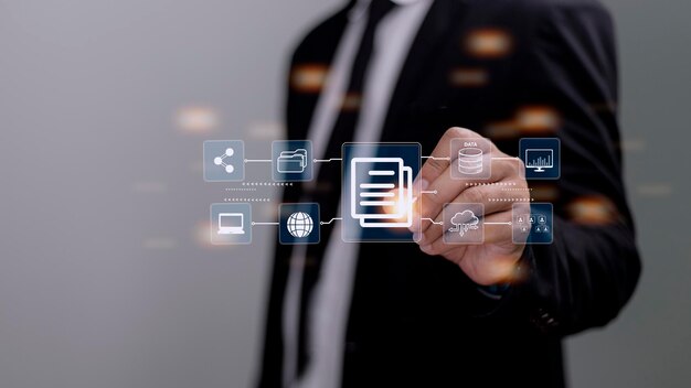 Premium Photo | Businessman using a computer to document management ...