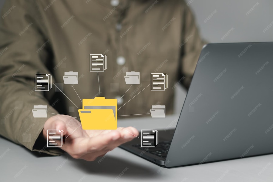 Premium Photo | Businessman using laptop with database on computer to ...