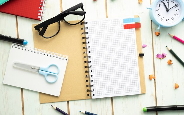 Premium Photo | Busy student's desk with blank open notebook Premium Photo | Busy student's desk with blank open notebook