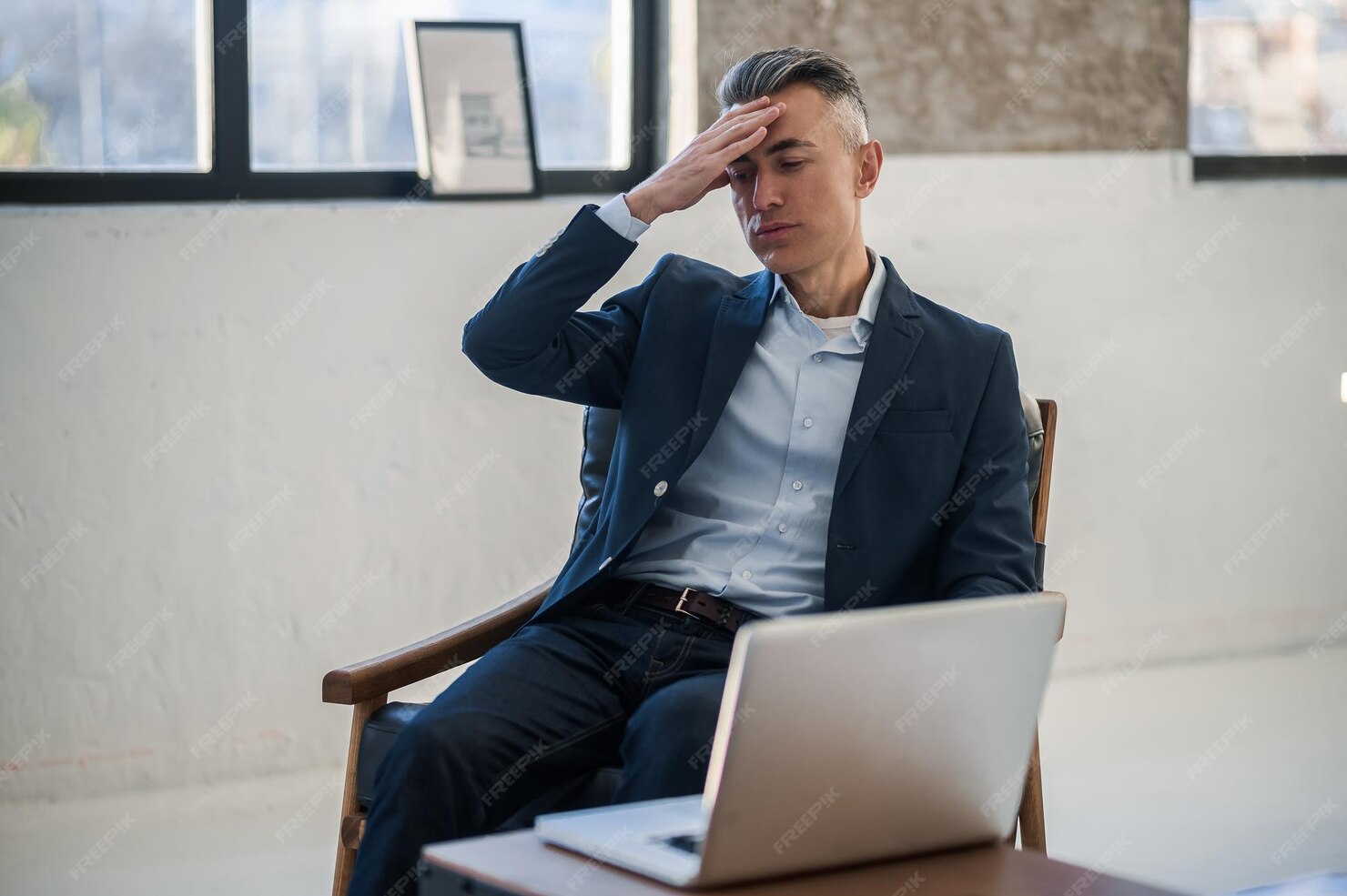 Premium Photo | Caucasian businessman sitting in the office and working Premium Photo | Caucasian businessman sitting in the office and working