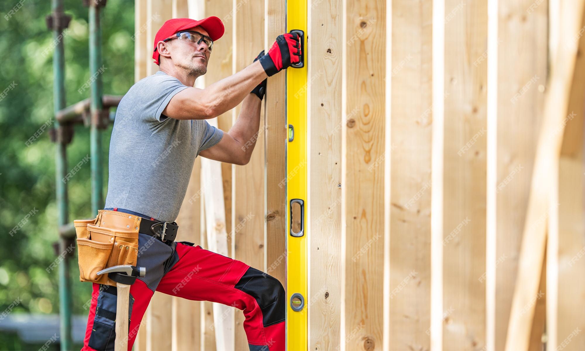 Premium Photo | Caucasian construction contractor with a spirit level ... Premium Photo | Caucasian construction contractor with a spirit level ...