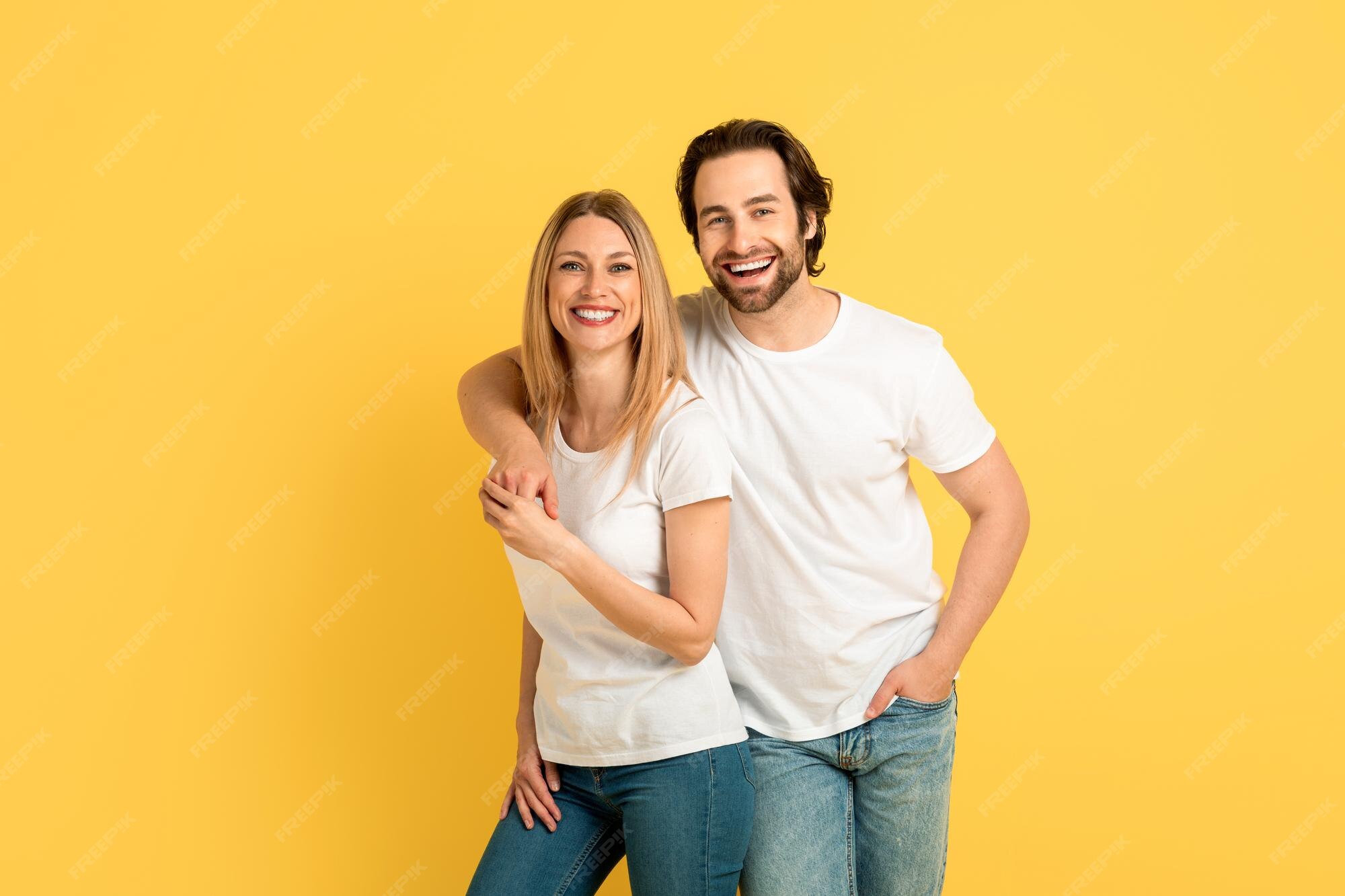 Premium Photo Cheerful Glad Millennial Caucasian Male Hugging Blonde